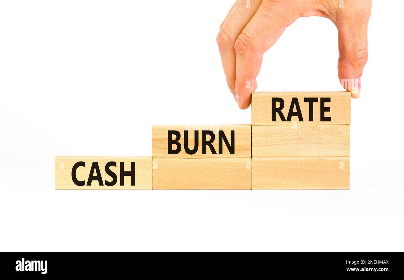 Cash burn rate symbol. Concept words Cash burn rate on wooden blocks on ...