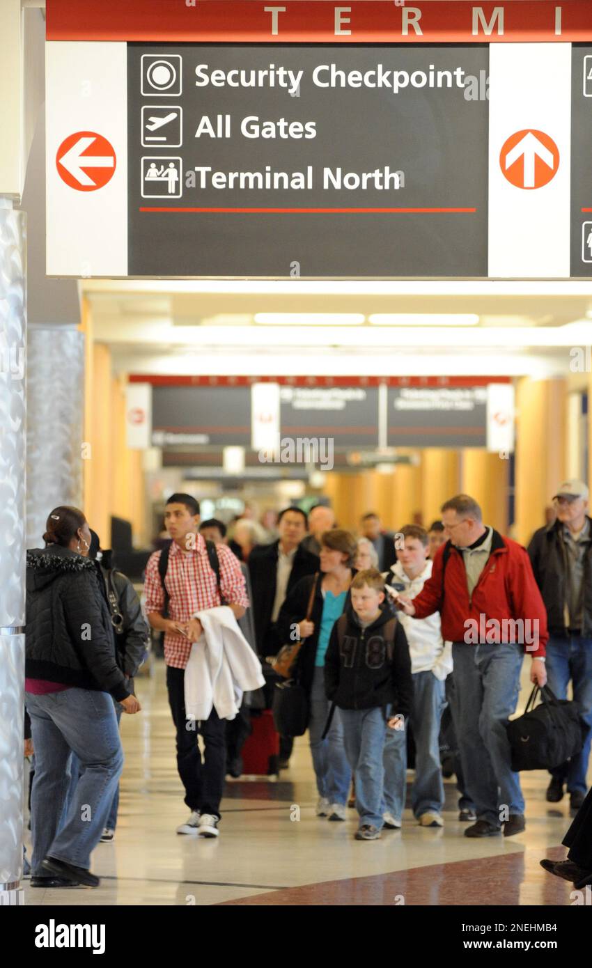 Air travelers enter the security checkpoint area at Hartsfield Jackson ...