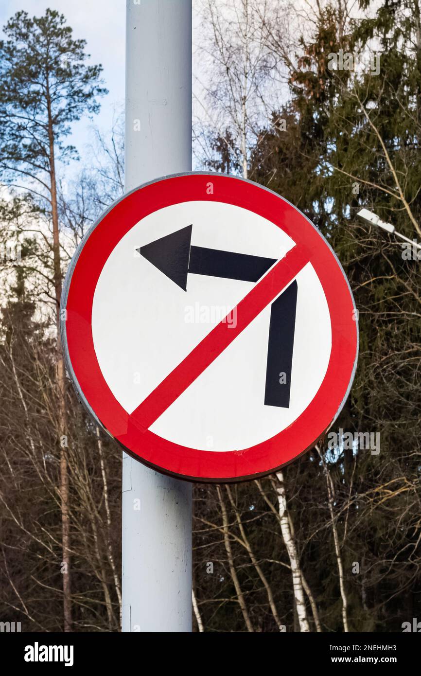 No turning road sign on forest background Stock Photo - Alamy