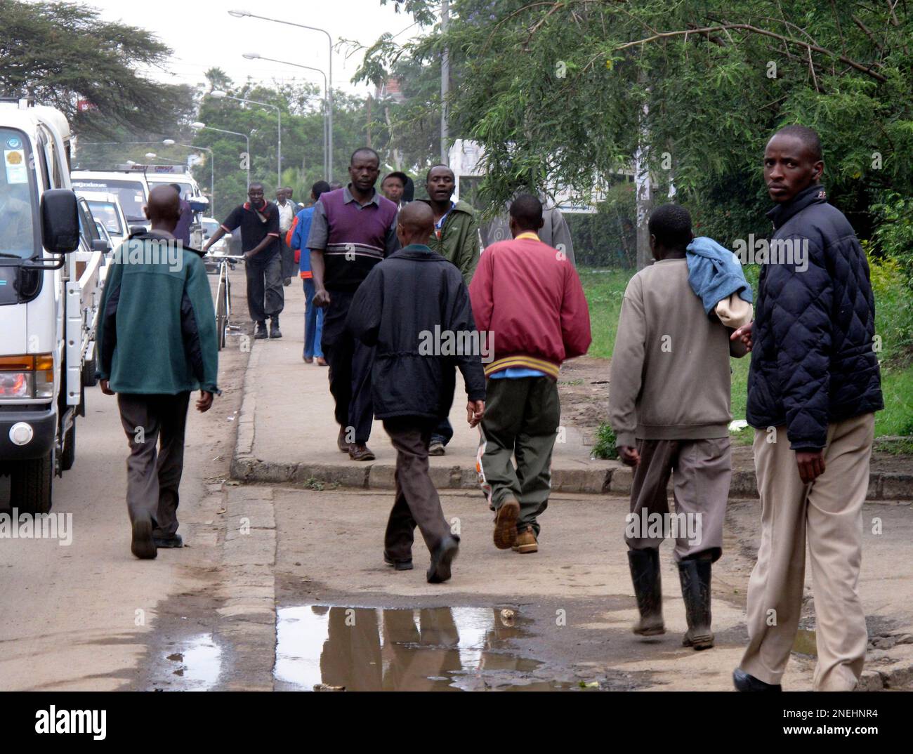 Kenyan workers walk home after work, due to a nationwide strike by ...