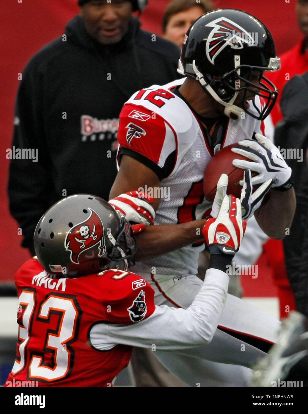 Atlanta Falcons wide receiver Michael Jenkins (12) is caught by Tampa ...