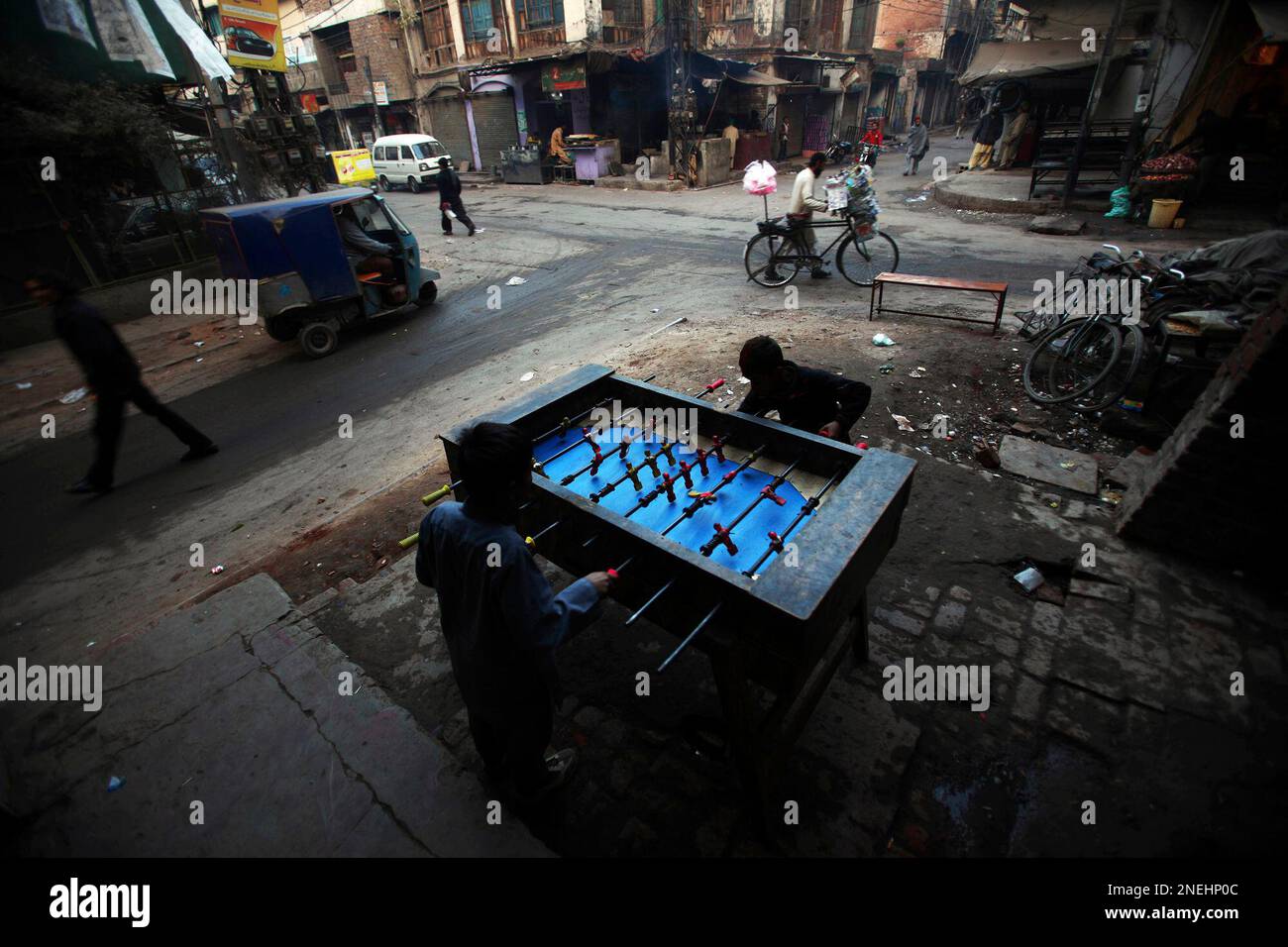Pakistani boys play table football in Lahore, Pakistan, Monday, Jan. 4 ...