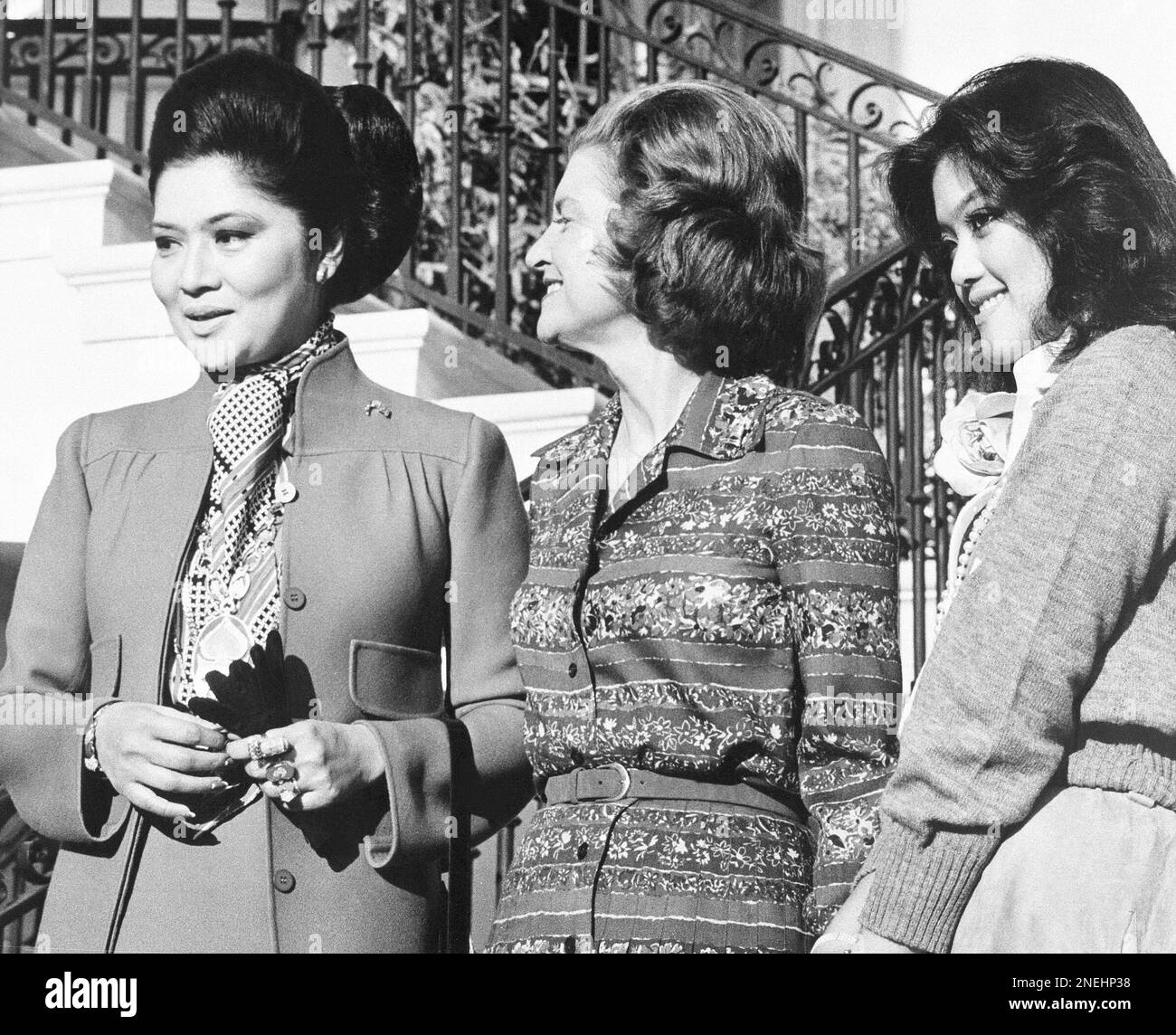 First Lady Betty Ford, center, greets Mrs. Imelda Marcos, left, wife of ...