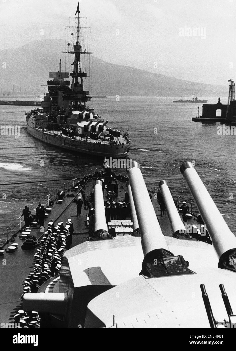 A view of the Italian warship 'Conte De Cavour' seen over the gun ...