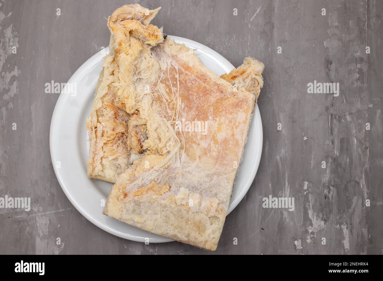 salted dry cod fish on white dish on ceramic Stock Photo - Alamy