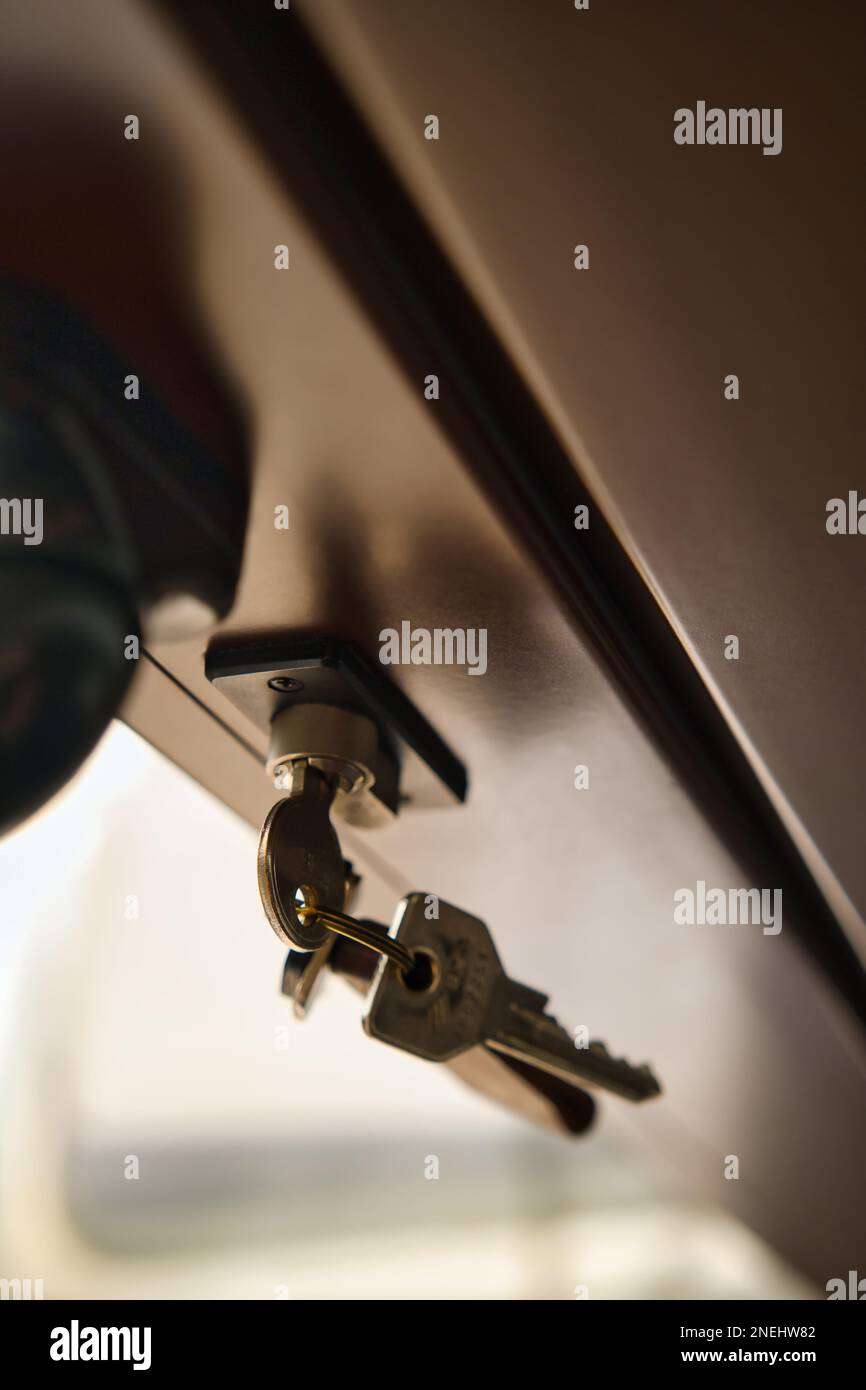High angle close up of the key on the door Stock Photo - Alamy