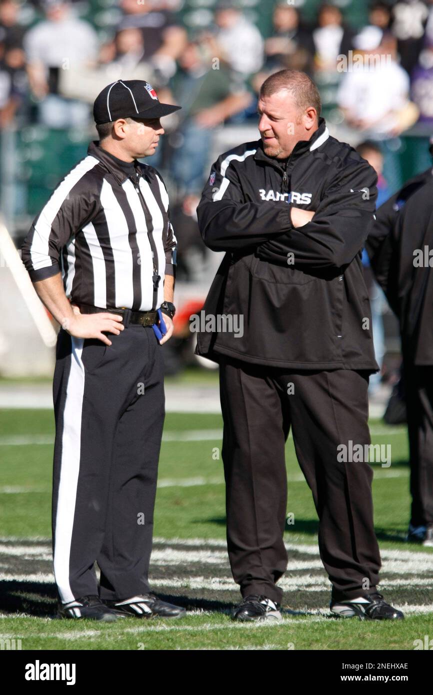 Oakland Raiders' head coach Tom Cable walks on the field during pregame ...