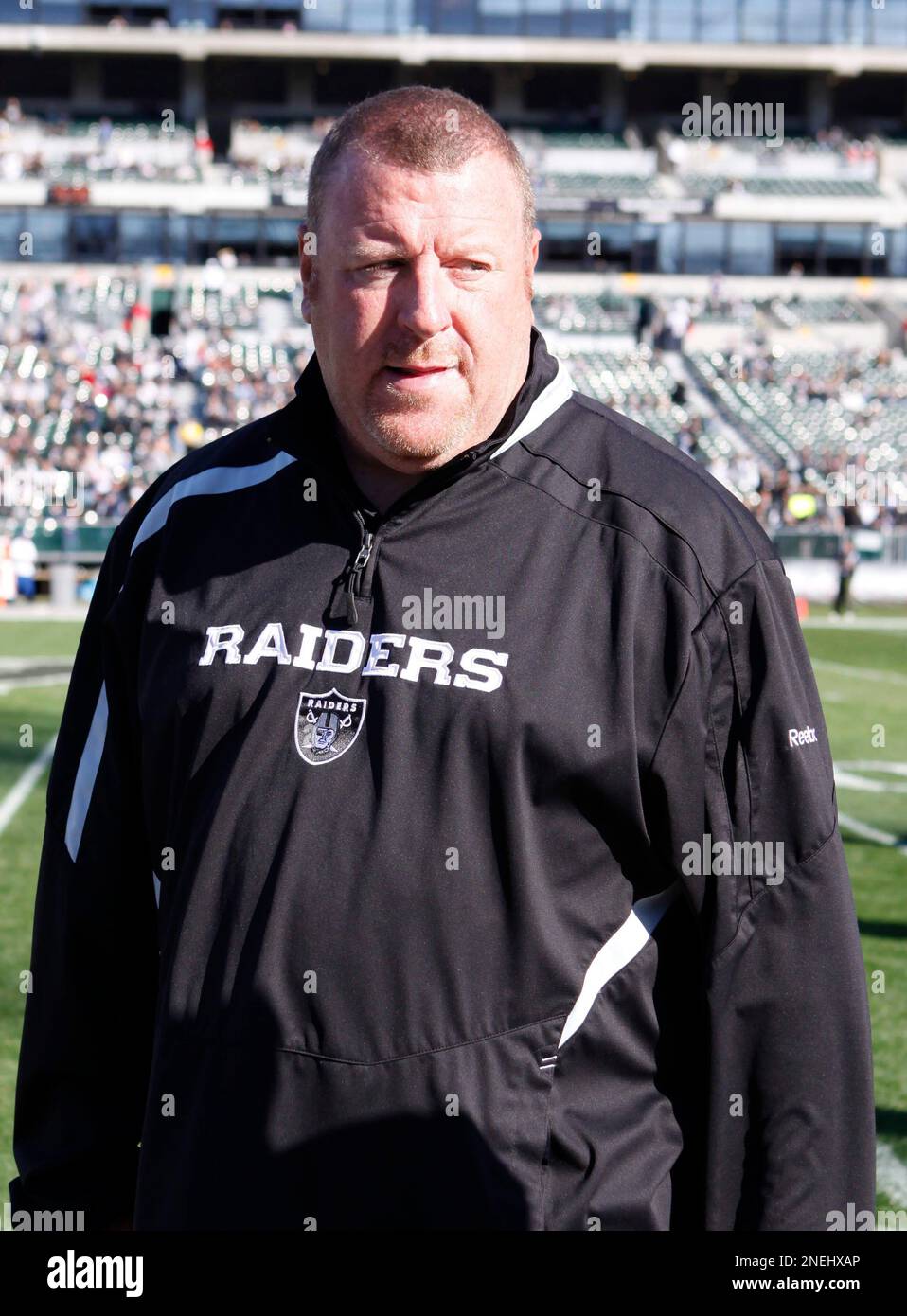 Oakland Raiders' head coach Tom Cable walks on the field during pregame ...