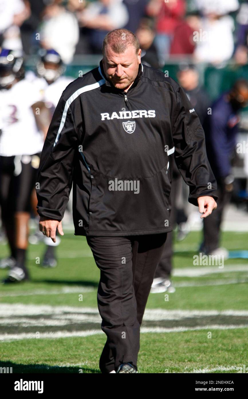 Oakland Raiders' head coach Tom Cable walks on the field during pregame ...