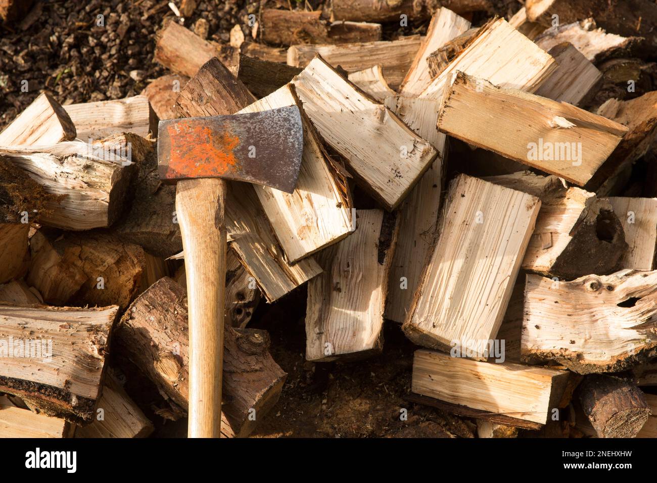 Logs that have been split with an axe that will be placed in a ...