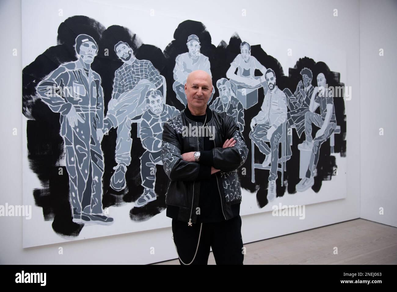 Artist, Eric Haze poses in front of his artwork during the exhibition ...