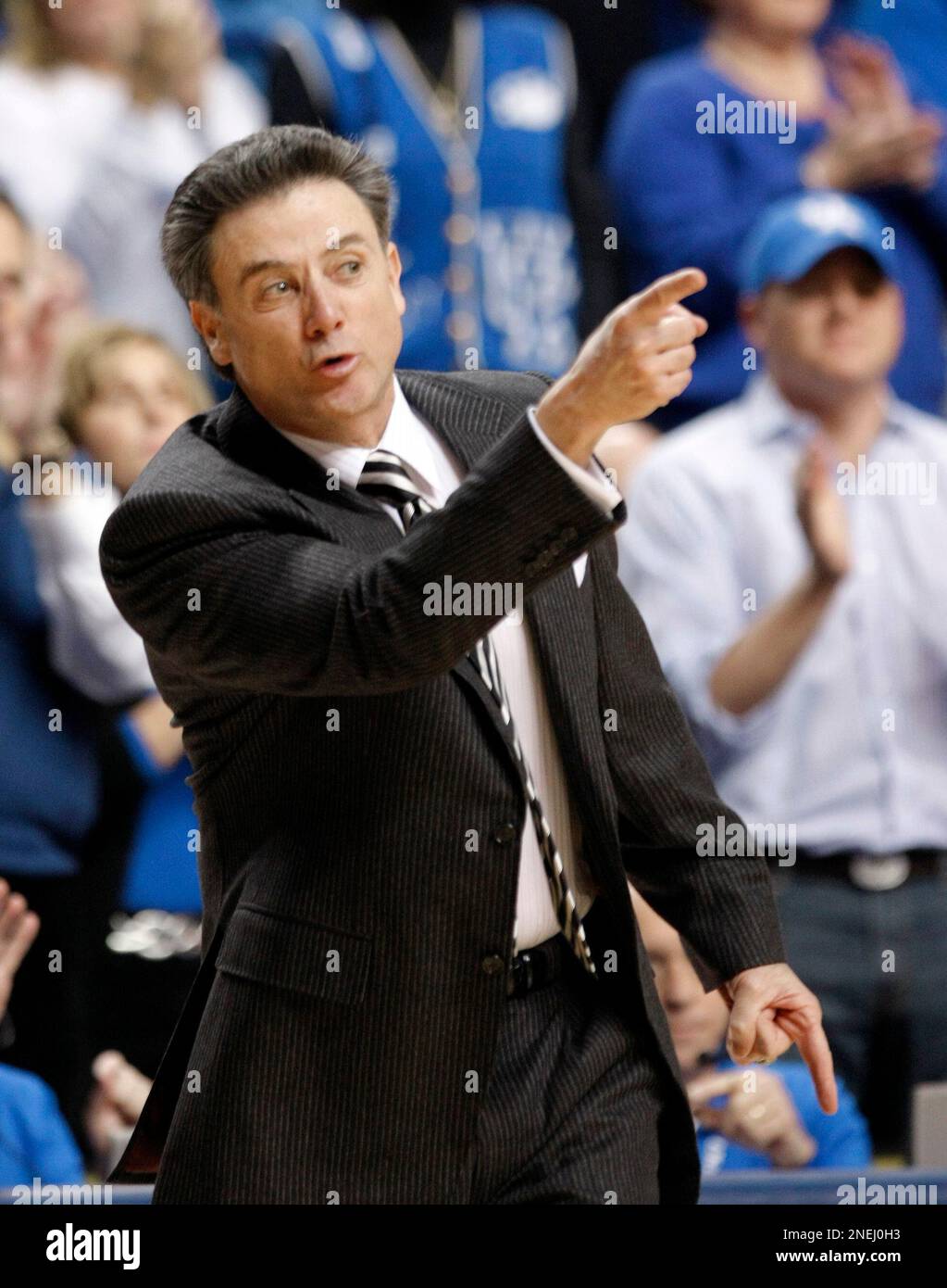 Louisville coach Rick Pitino directs his players during the first half ...