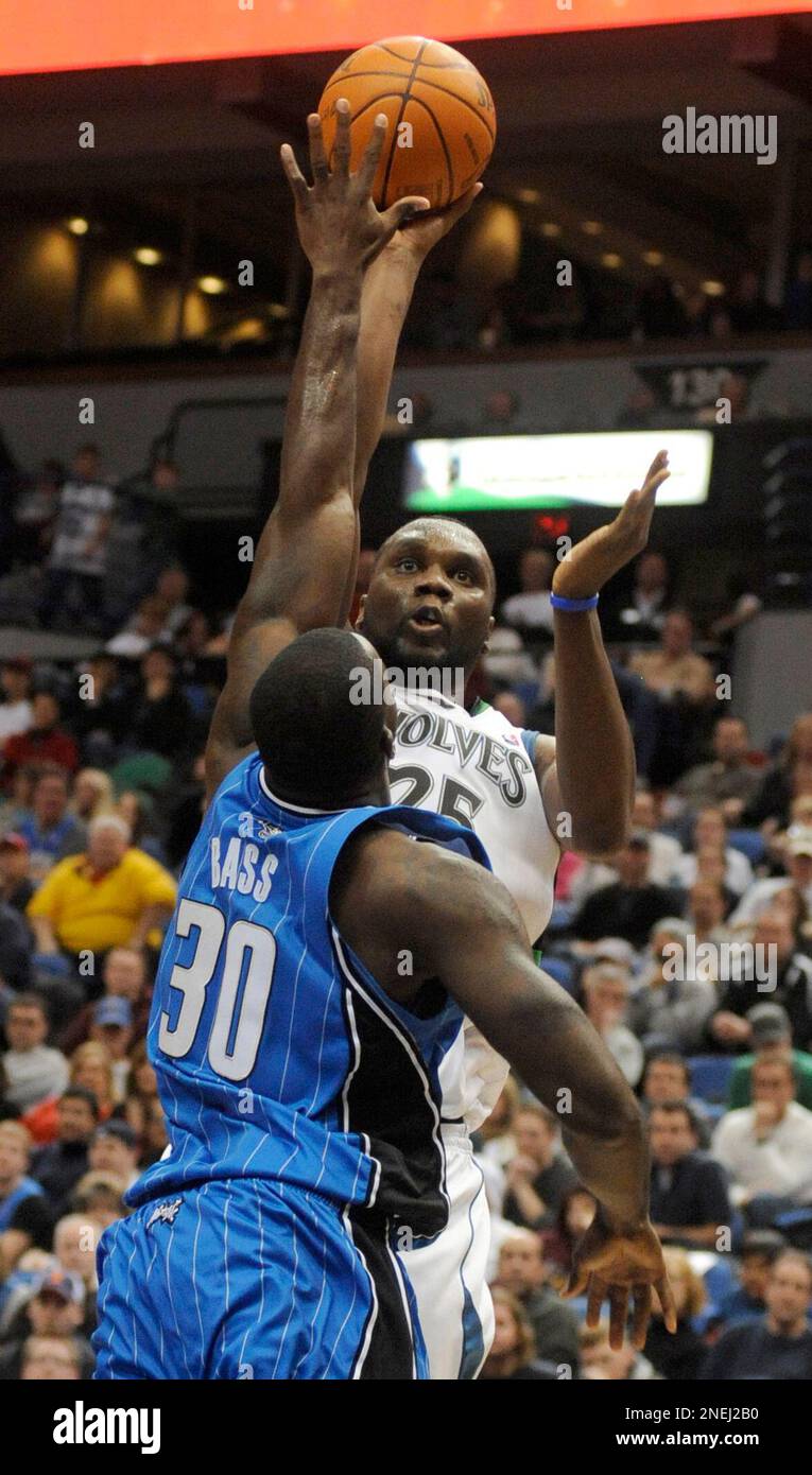 Minnesota Timberwolves' Al Jefferson, top, shoots against Orlando Magic ...