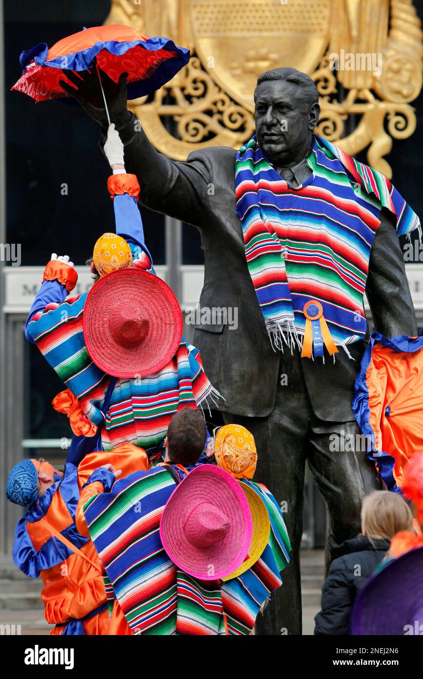 After marching in the Mummers Parade, members of the Froggy Carr New Year's Brigade place an ...
