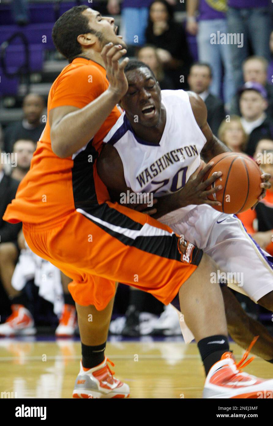 Oregon State's Joe Burton blocks Washington's Quincy Pondexter, right ...