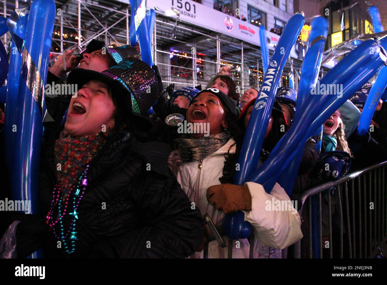 Revelers cheer shortly before midnight on New Year's Eve in New York's ...