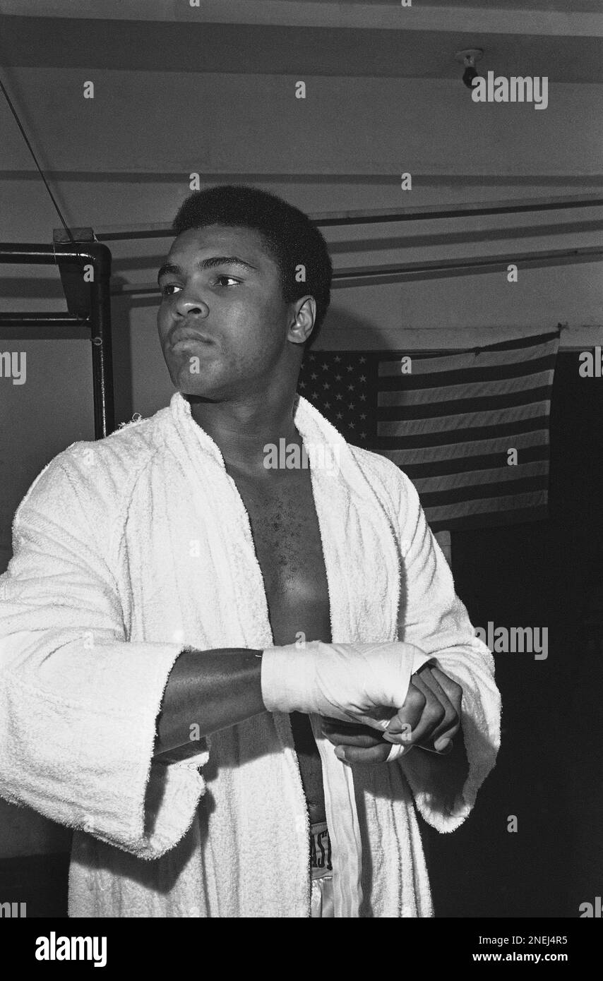 Heavyweight challenger Muhammad Ali has fists taped by trainer Angelo Dundee on March 4, 1971 in ...