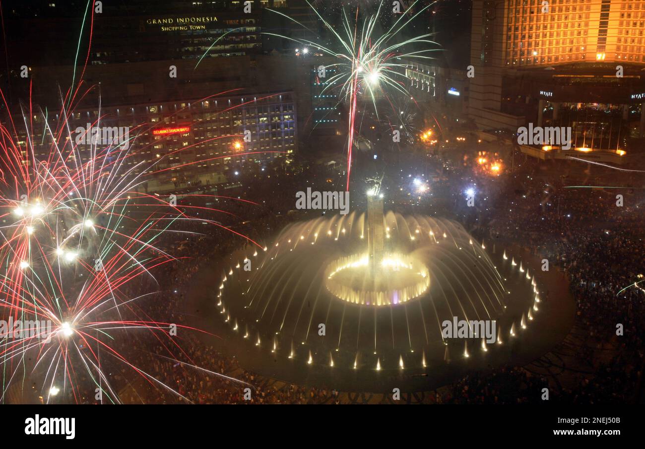 Fireworks explode above downtown Jakarta's Welcome Monument, Indonesia ...