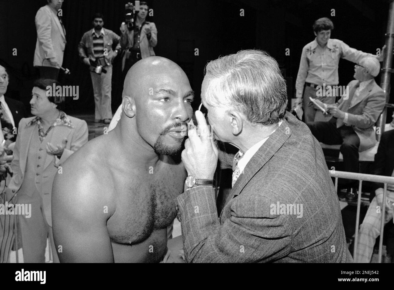 Dr. A. Harry Kleiman gives exams boxer Earnie Shavers during preflight ...