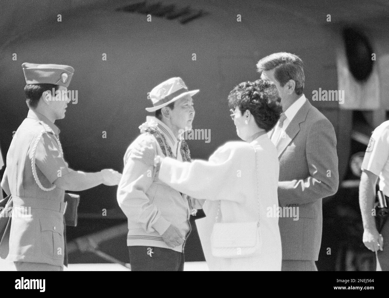 Exiled former Philippine President Ferdinand Marcos receives a warm ...