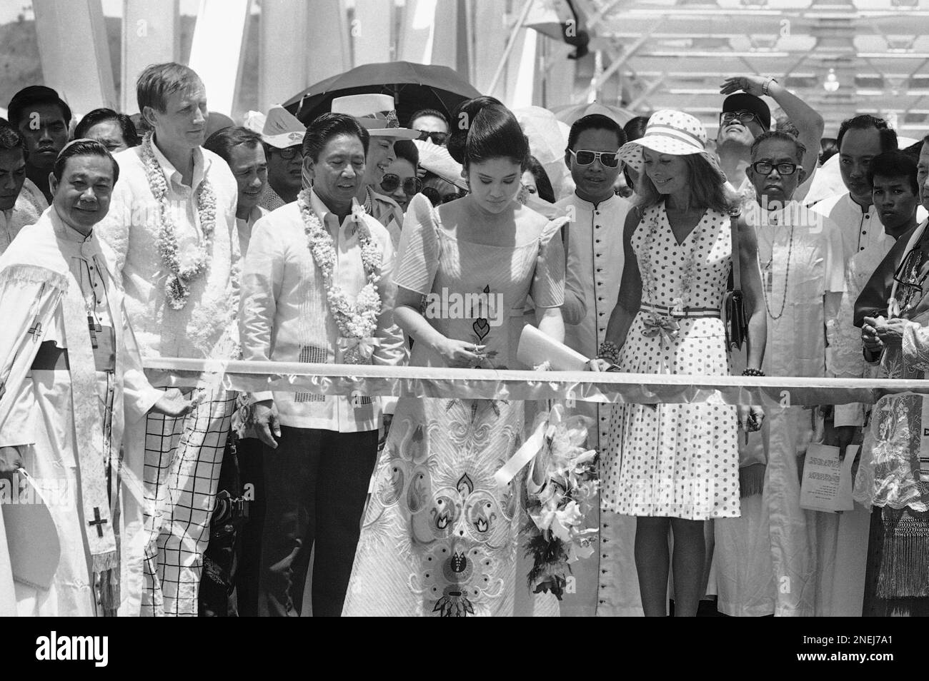 Philippine President Ferdinand E. Marcos, third from left, assists ...