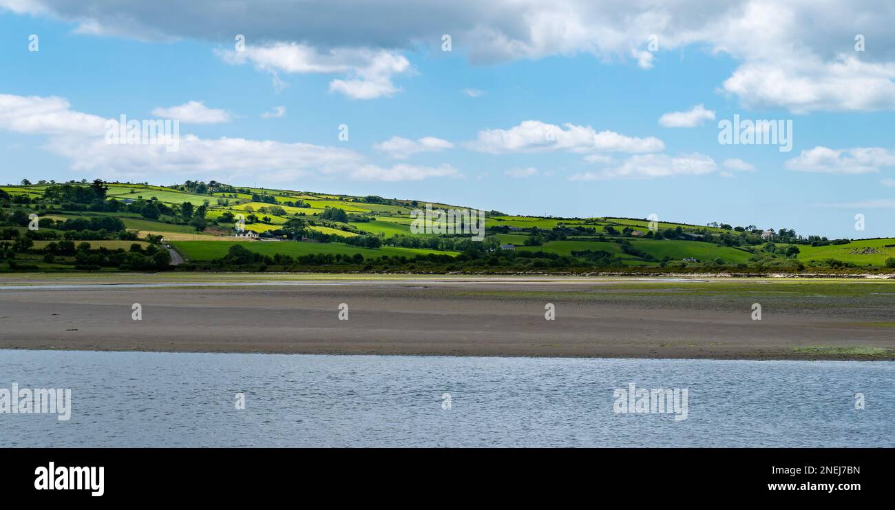 White clouds in the sky, Irish countryside. Green hills on a nice ...