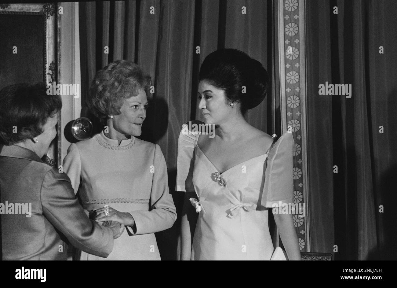 Mrs. Pat Nixon introduces guests to Mrs. Imelda Marcos at a luncheon at ...