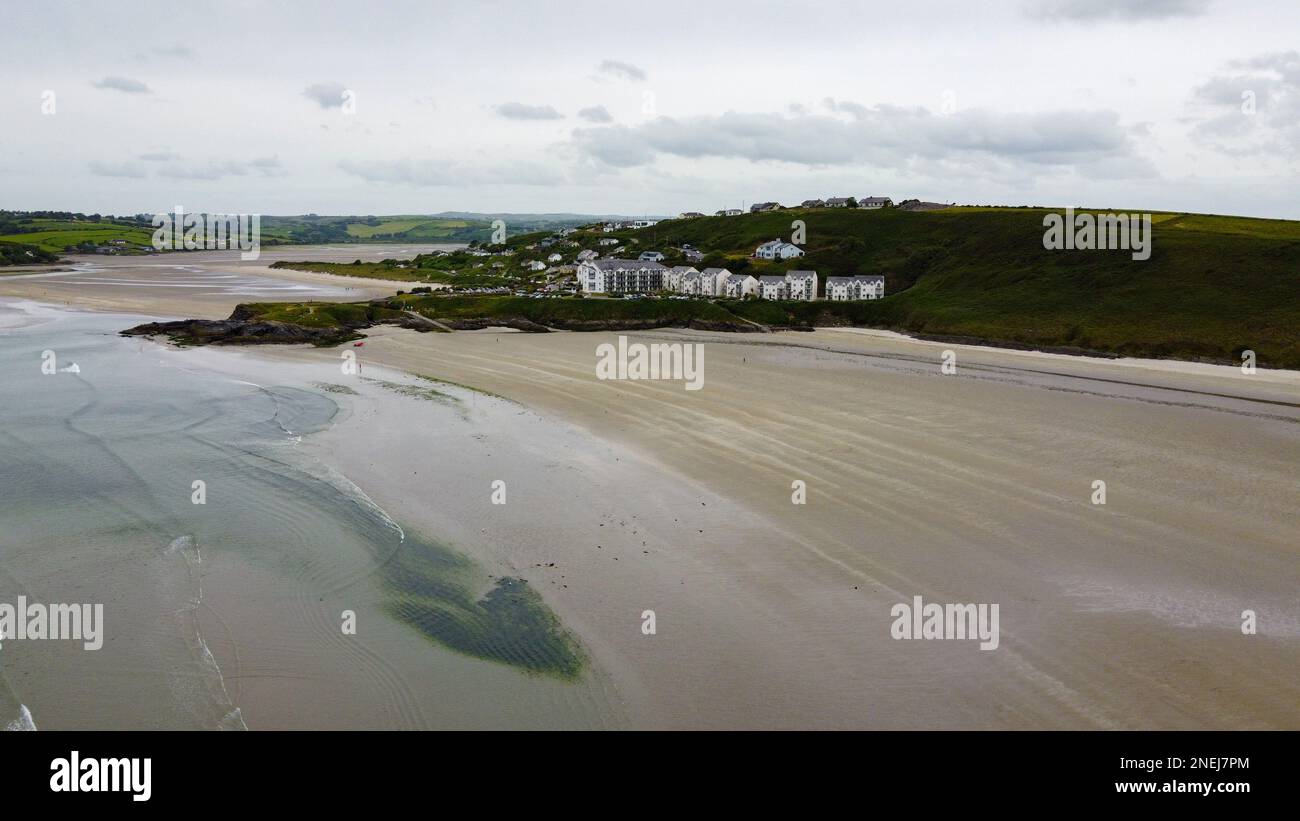 Grey cloudy sky over Inchydoney beach and Cape Virgin Mary on a summer ...