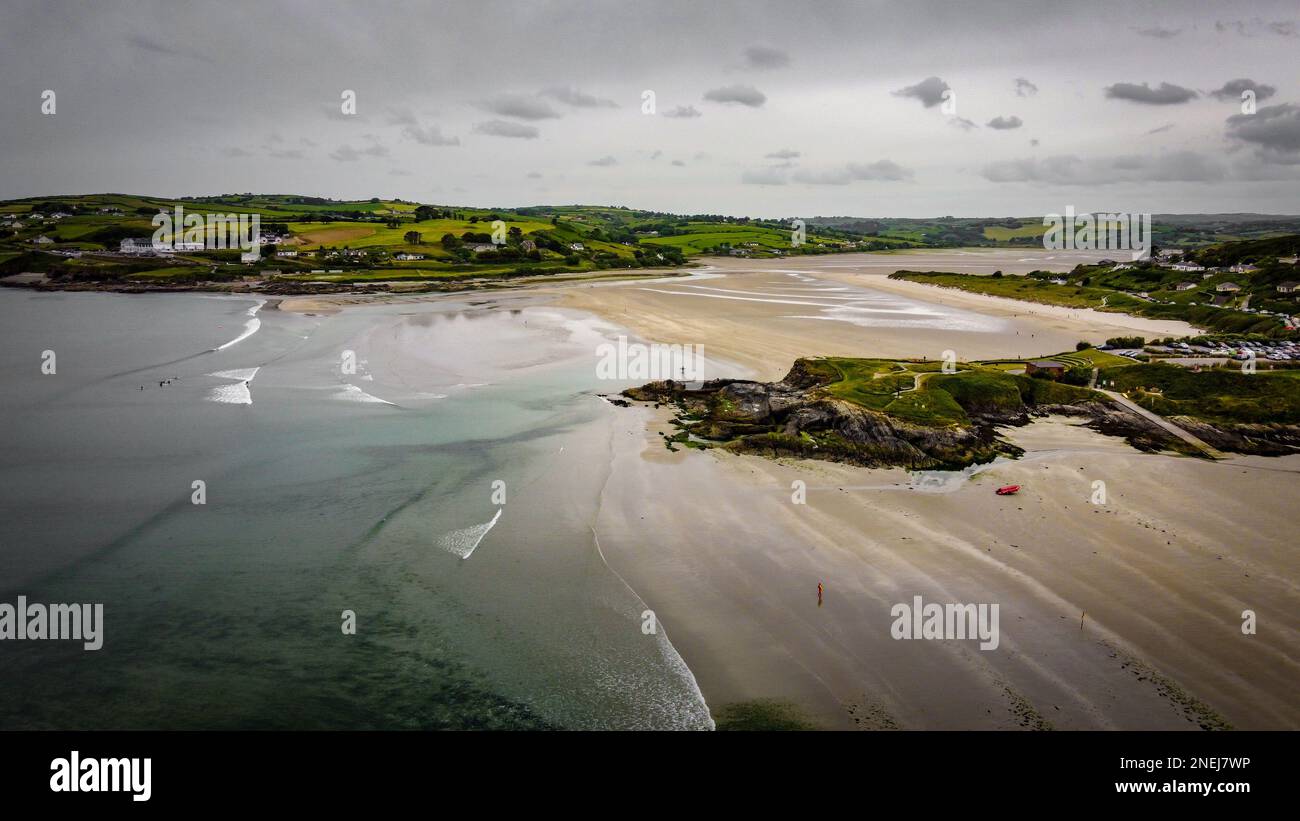 Grey sky, Inchydoney beach and Cape Virgin Mary on a summer. The famous ...