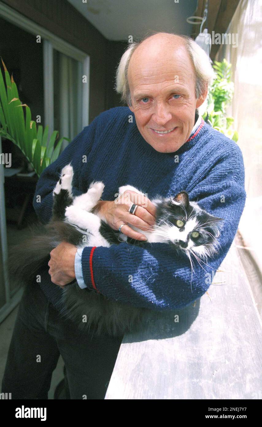Musician and actor Dan Harris poses with his cat ?Littow? at his home ...