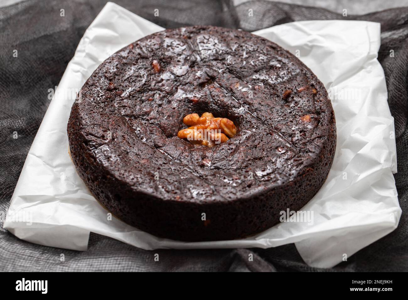 typical portuguese cake with dry fruits Bolo de Madeira on white paper ...