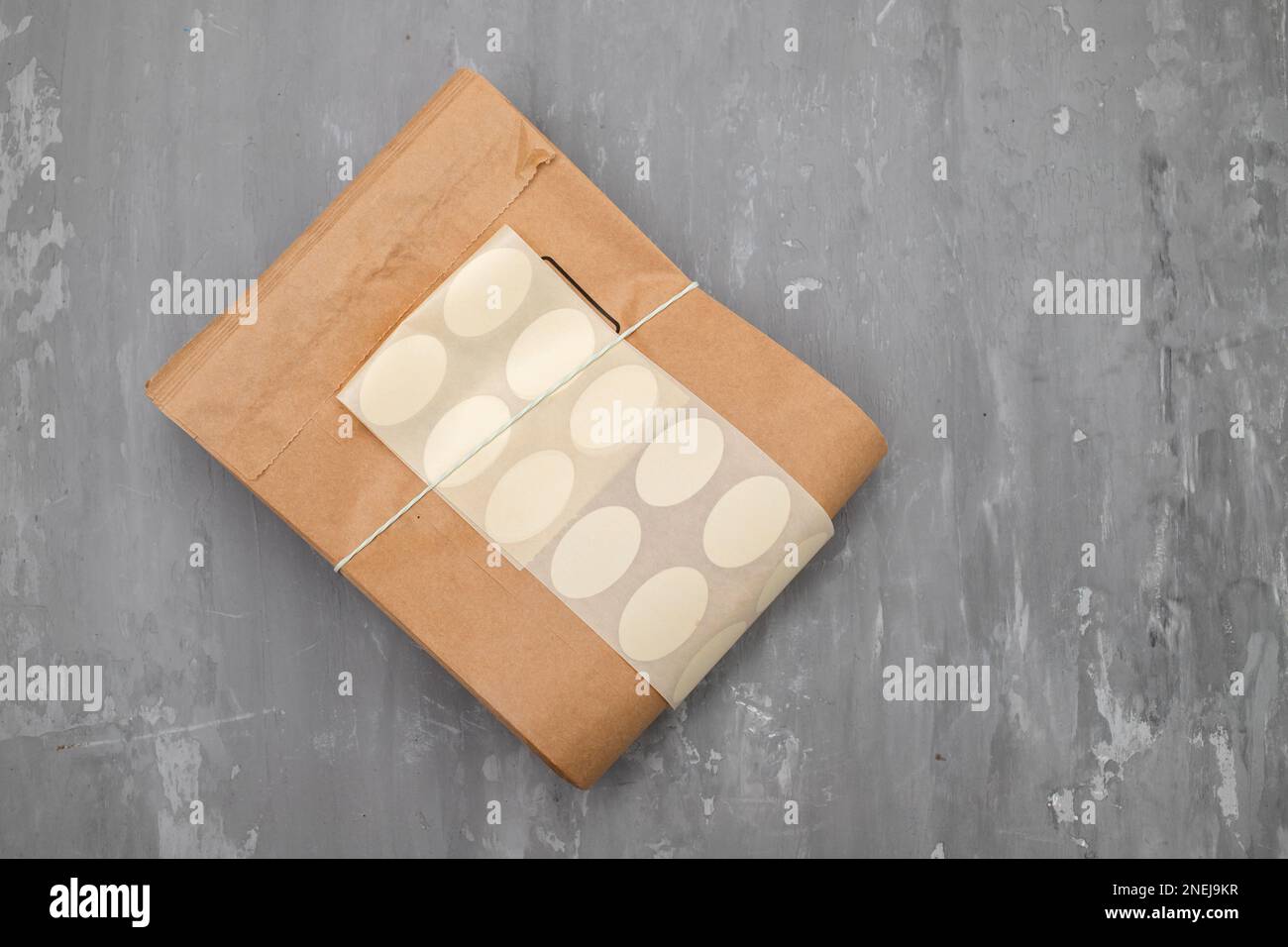 light brown paper bag with paper clip on ceramic Stock Photo - Alamy