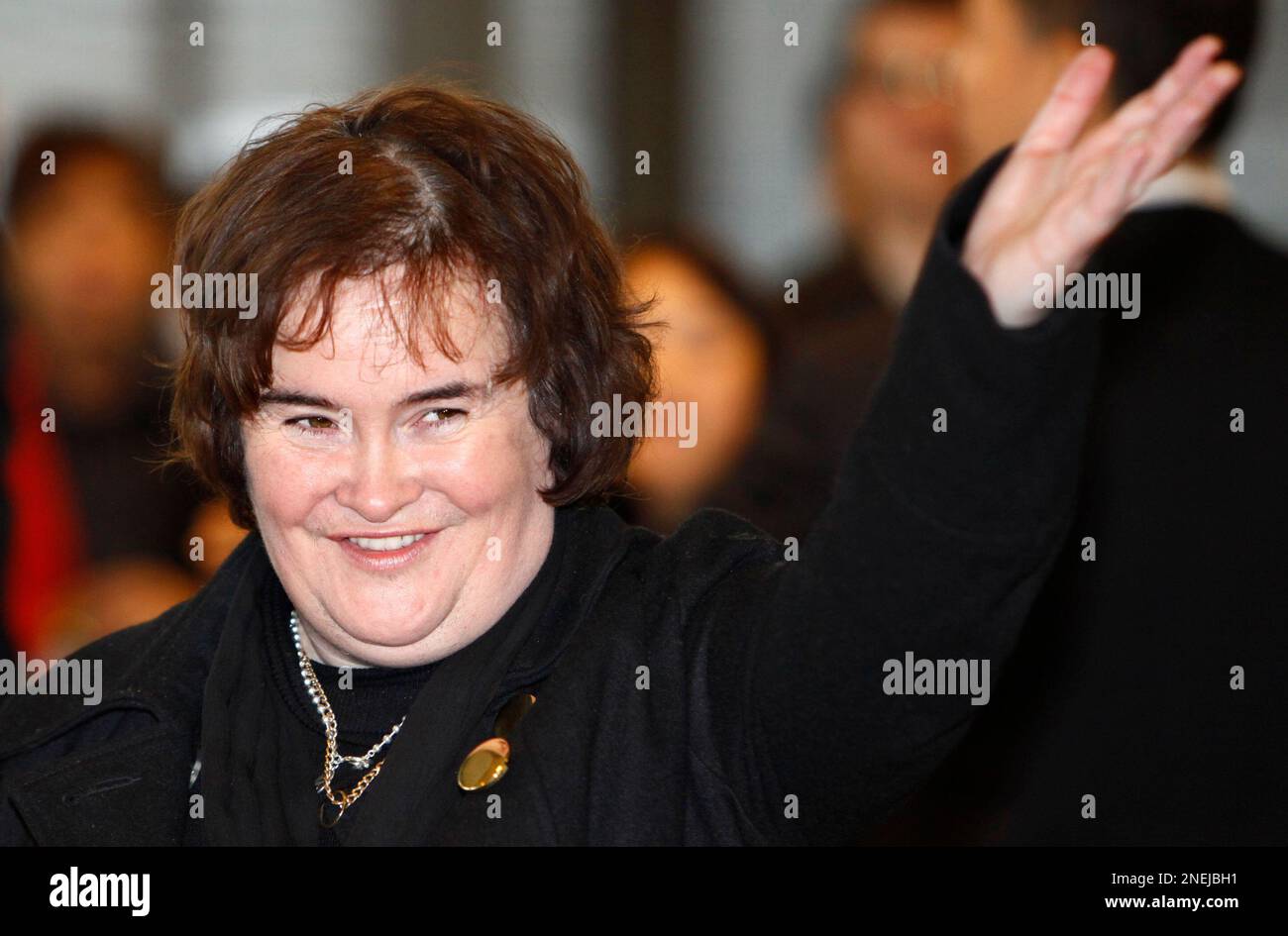 British singer Susan Boyle greets fans upon arriving at Narita ...