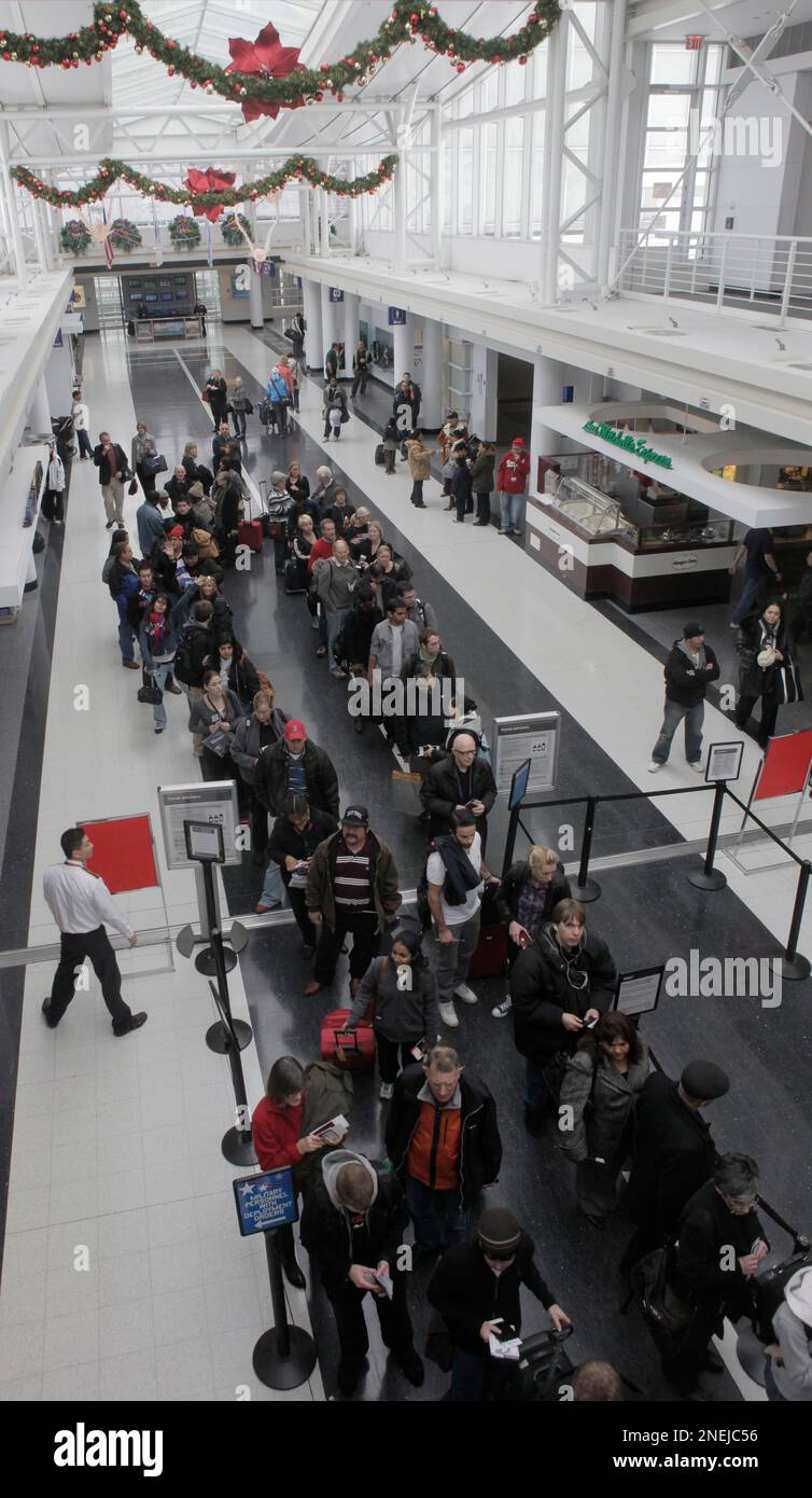 Passengers at O'Hare International Airport prepare to go through ...