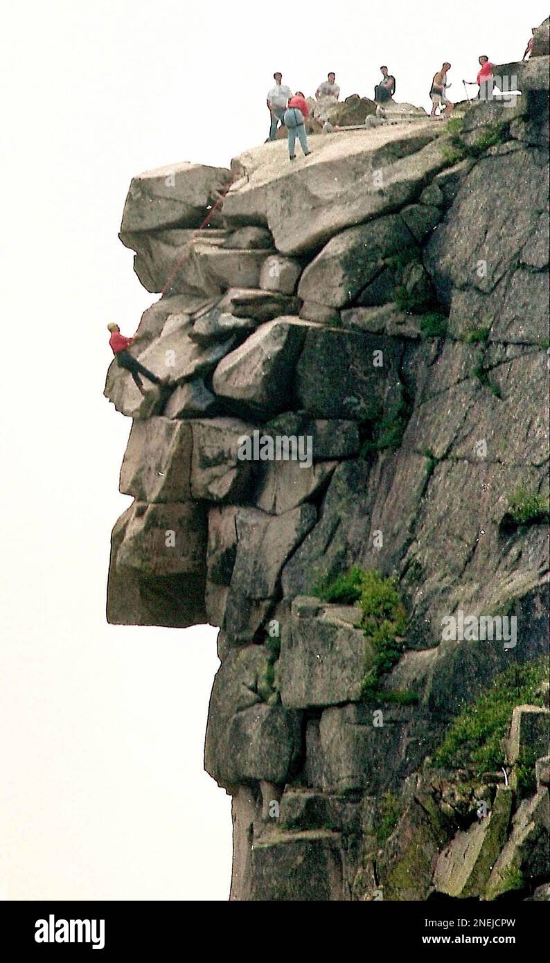 FILE - In this 1990's file photo, crews work on the symbolic Old Man of the Mountain in ...