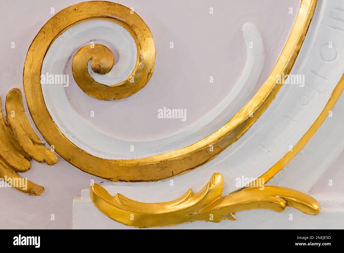 White gypsum bas-relief with gold colored details, wall design, rococo ...