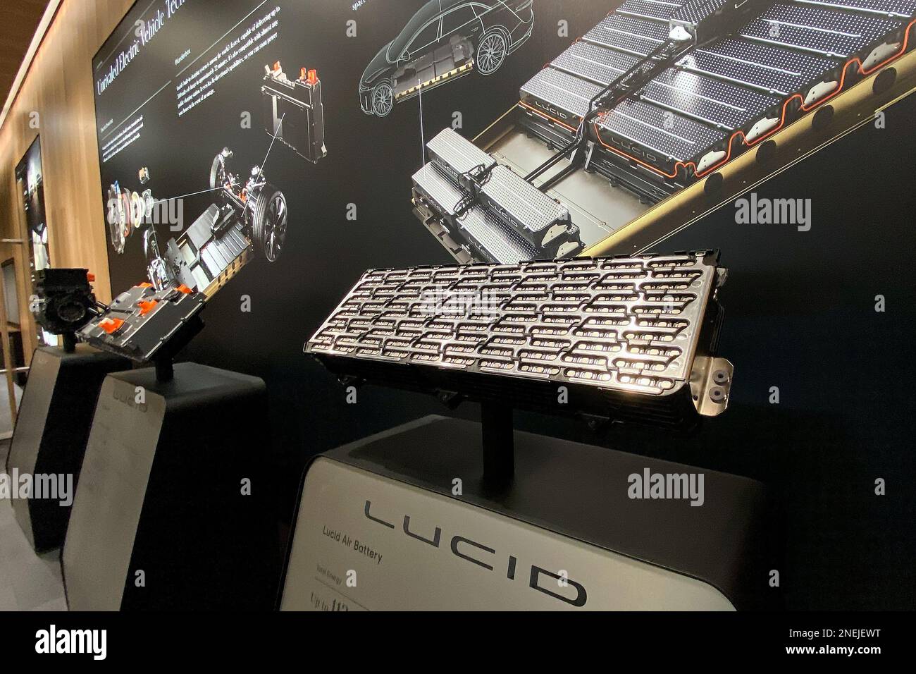 A Lucid Air electric car battery module, charging unit and motor sit on ...