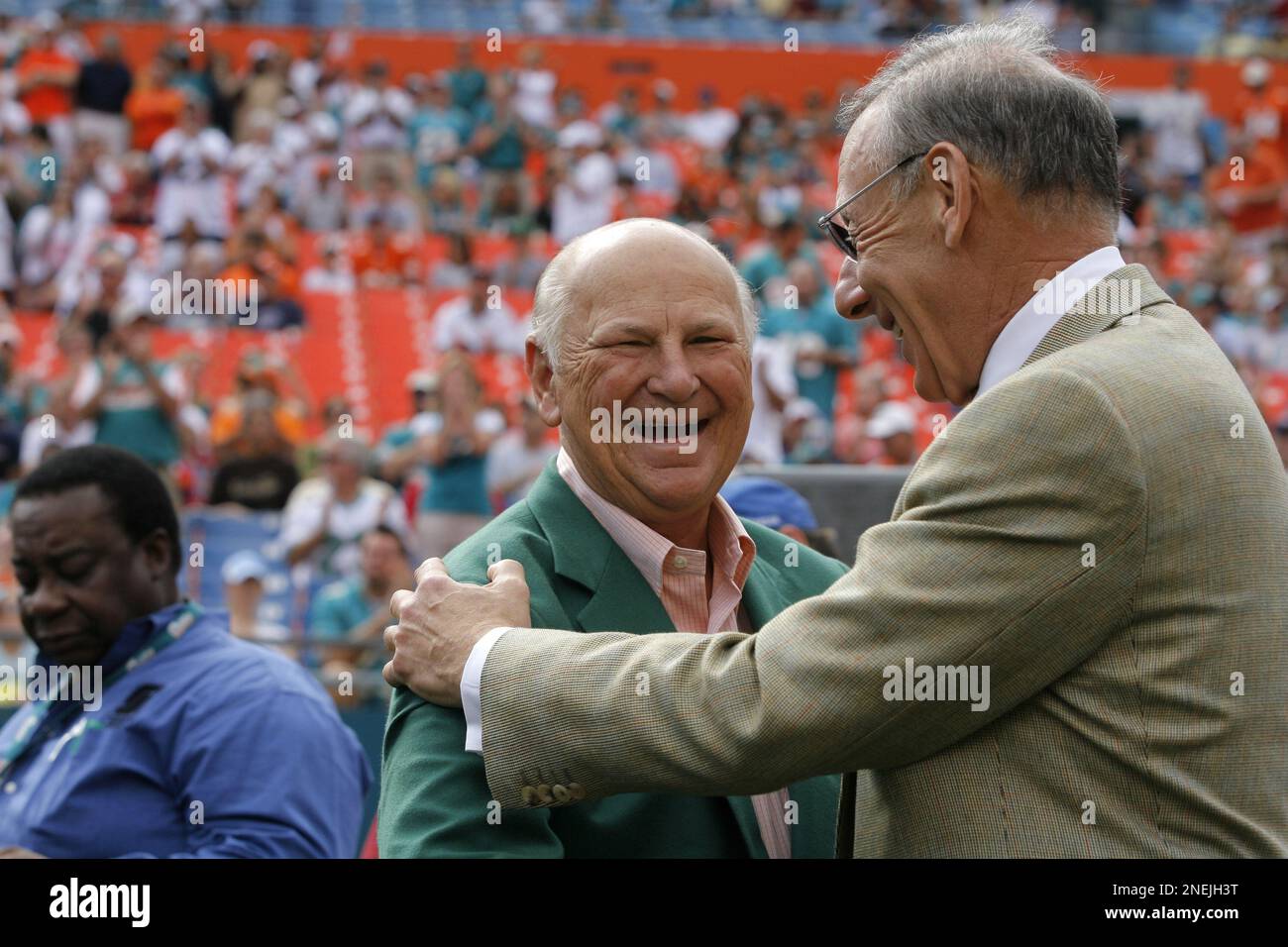 Former Miami Dolphins owner Wayne Huizenga, left, talks with current ...