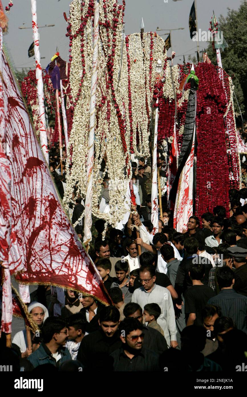 Pakistani Shiite Muslims take part in a procession on the eighth day of ...