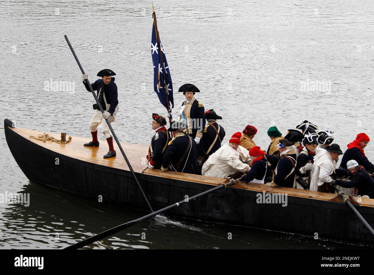 John Godzieba, portraying Gen. George Washington, fourth from left ...