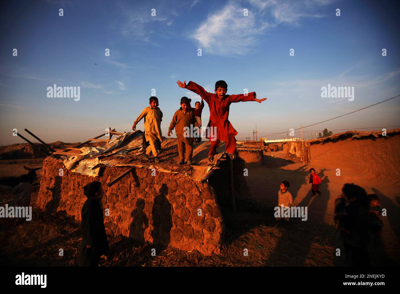 Afghan refugee children, play in the poor neighborhood of Rawalpindi ...