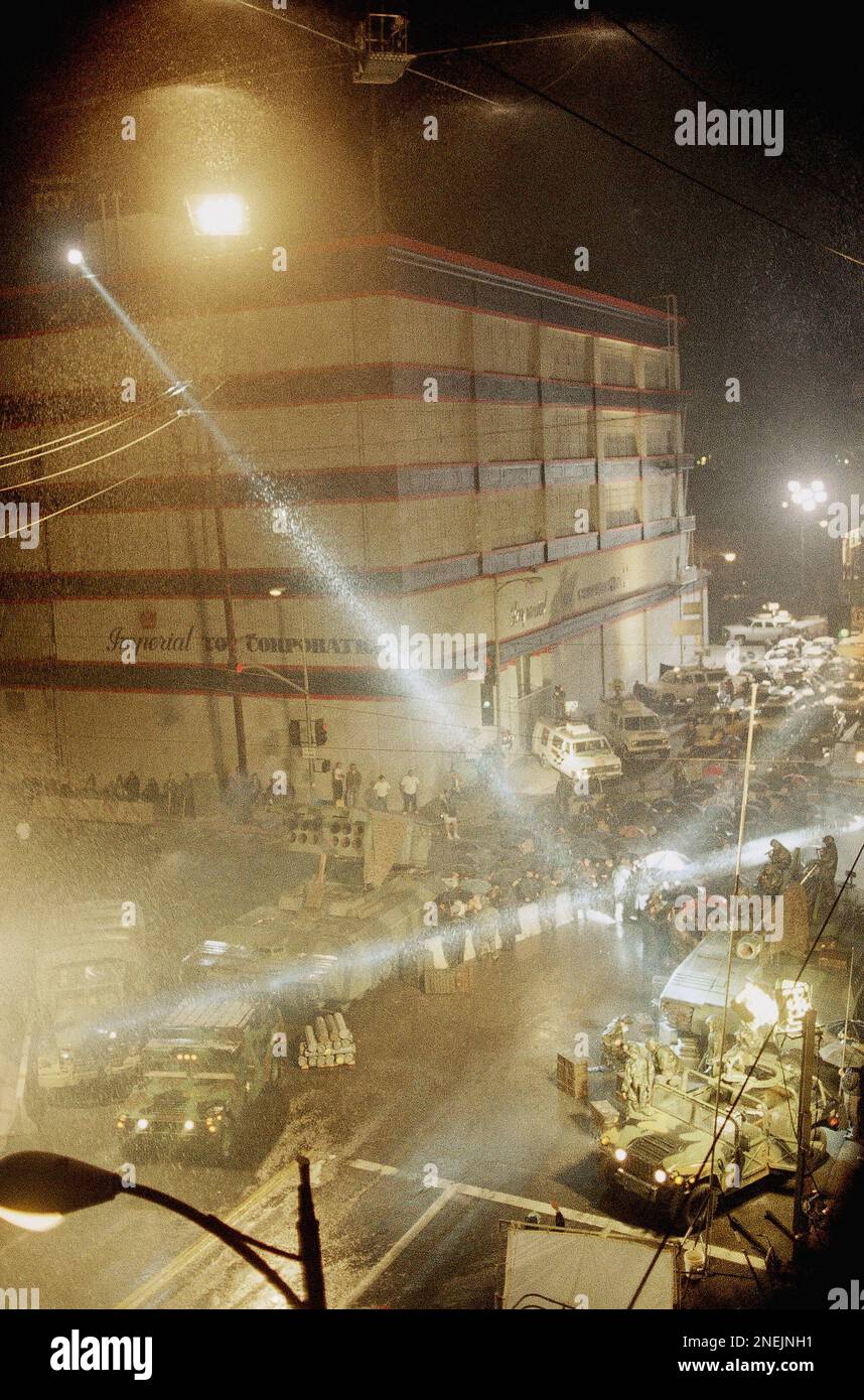 A rain-making machine spews gallons of water over hundreds of movie ...