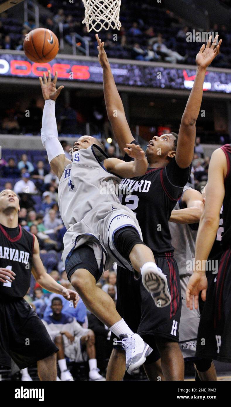 Georgetown's Chris Wright, left, goes to the basket against Harvard's ...