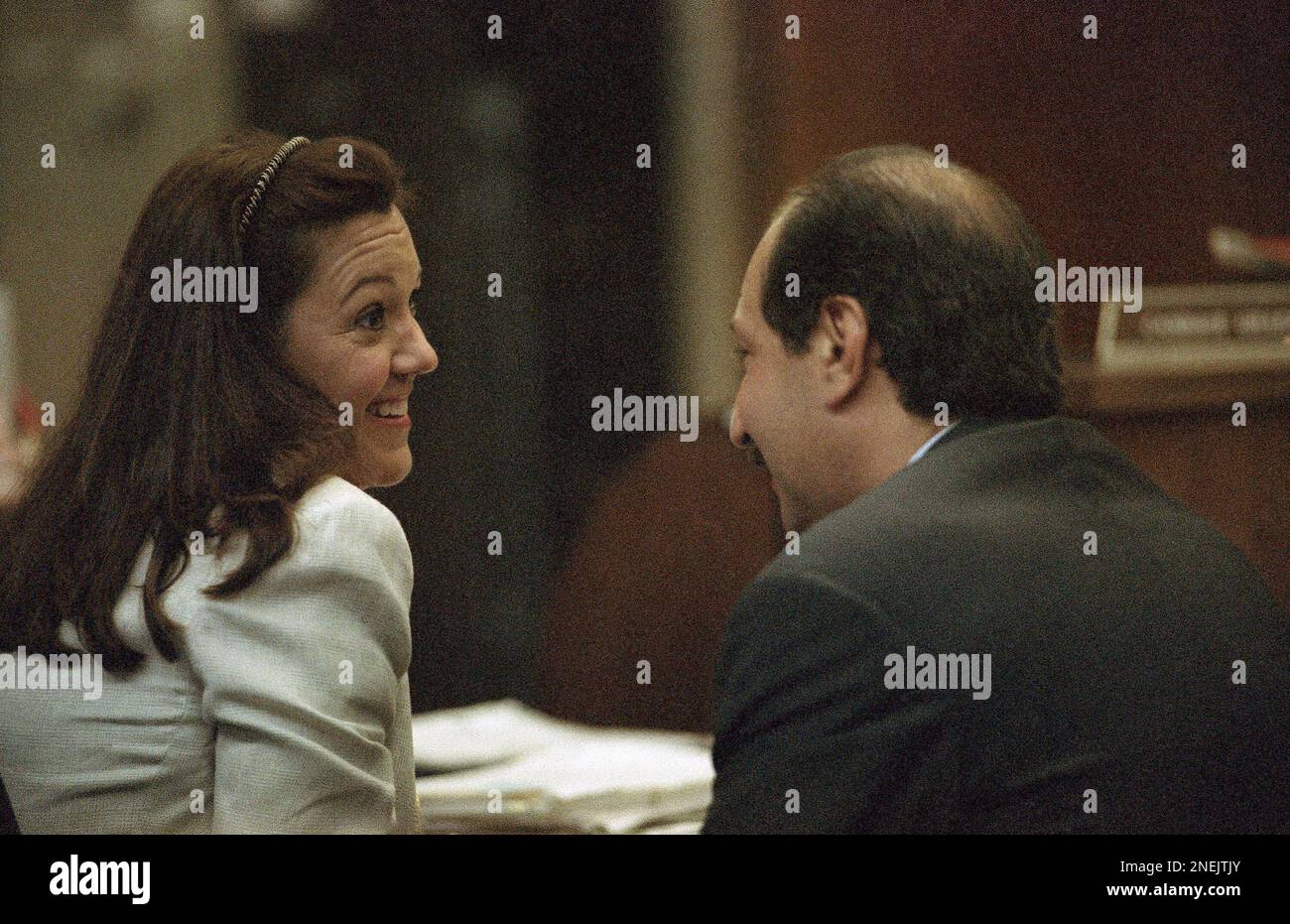 Whitewater figure Susan McDougal smiles as she talks with her attorney ...