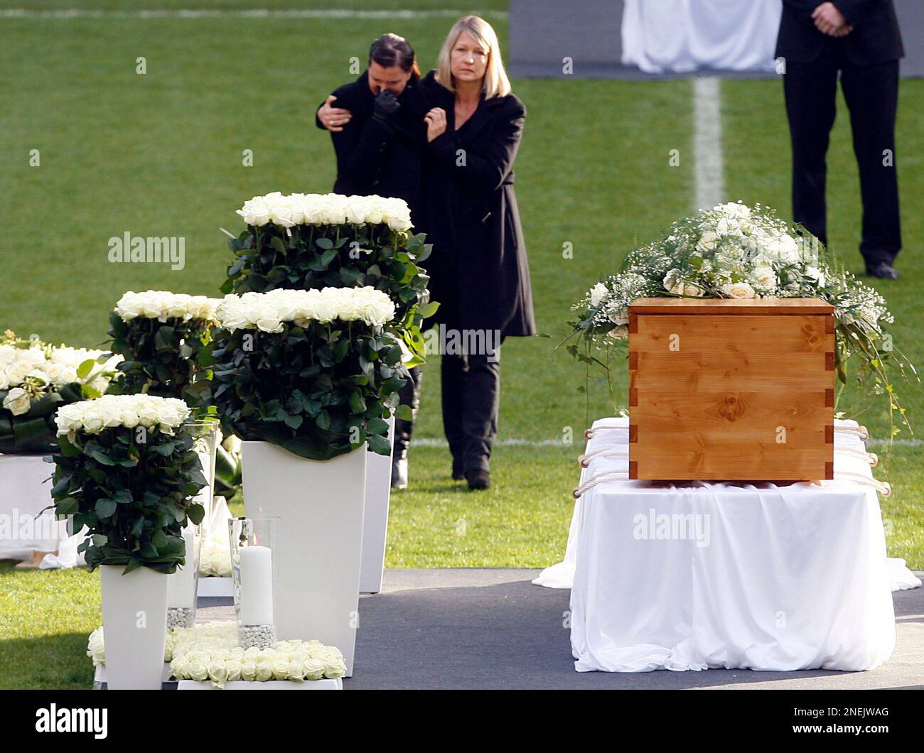 FILE - Enke' s wife Teresa, left, is comforted by an unidentified woman ...