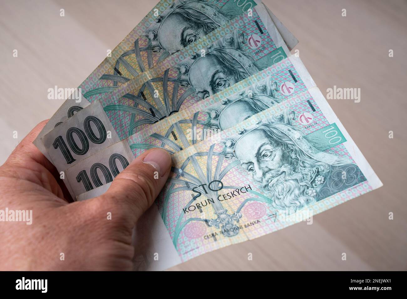 Czech Republic 100 korun paper banknote in man's hand Stock Photo - Alamy