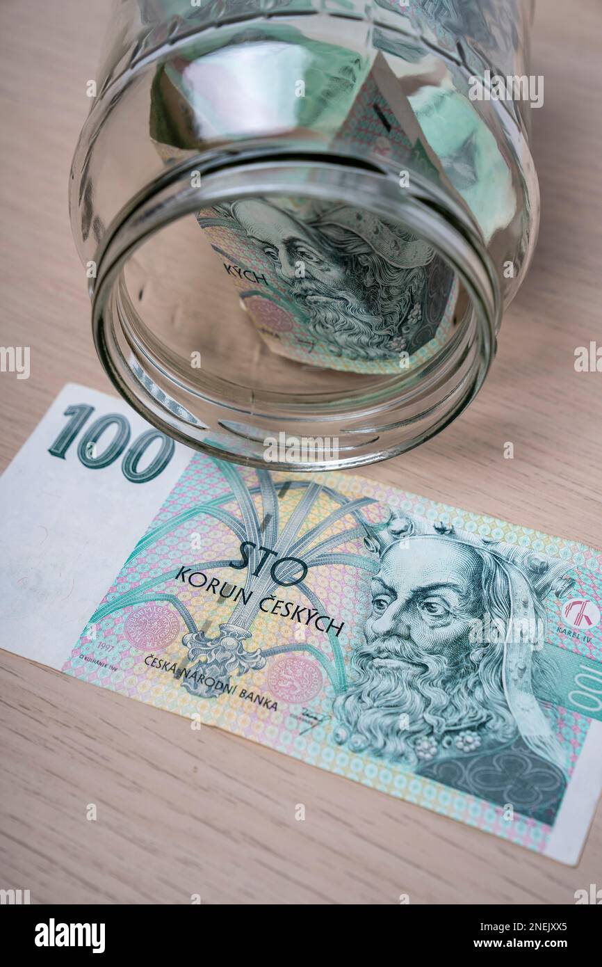 100 korun banknote of the Czech Republic banknotes in the glass jar ...