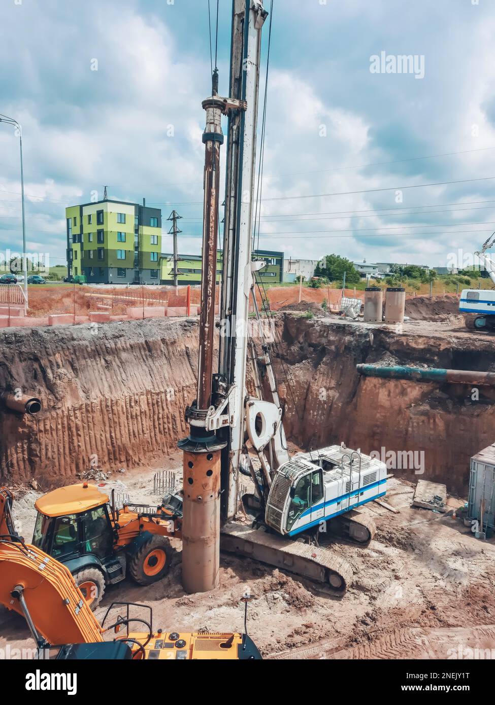 Hydraulic breaker machine for hammering piles in the pit Stock Photo ...