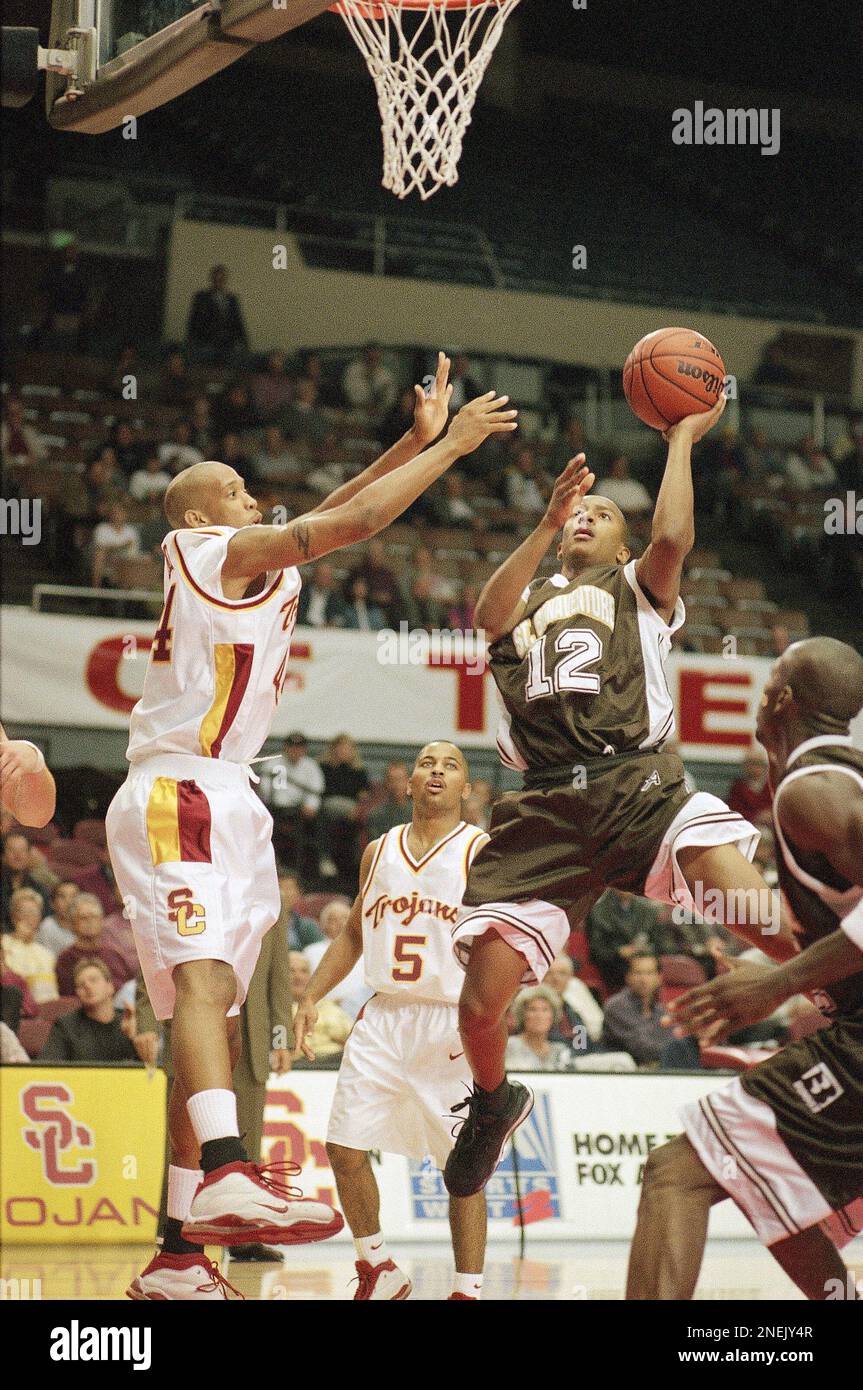 St. Bonaventure guard Ernest Bremer lofts a shot over the outstretched ...