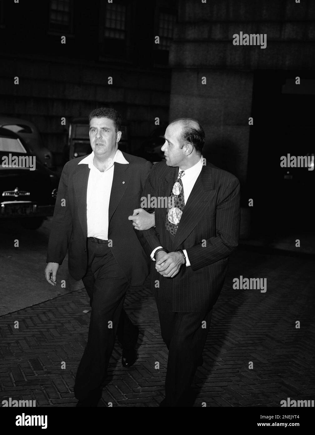 Raymond Fernandez, right, leaving the Federal Building with a ...